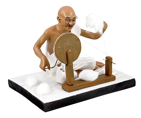 Mahatma Gandhi with his Charkha
